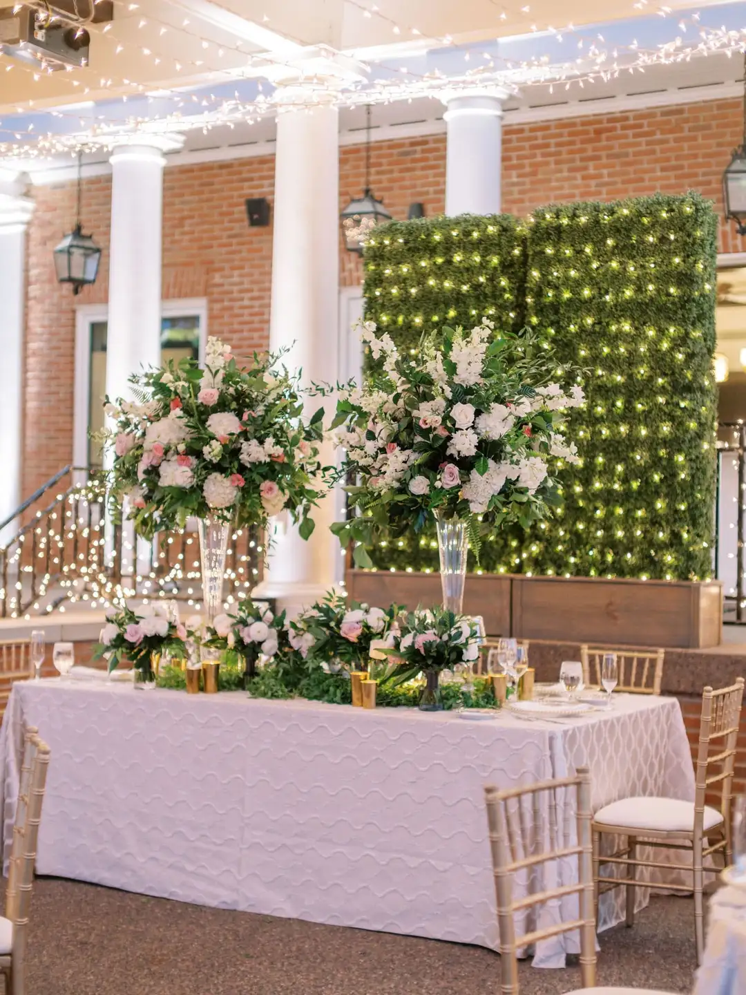 Head Table In Front of Hedge Wall