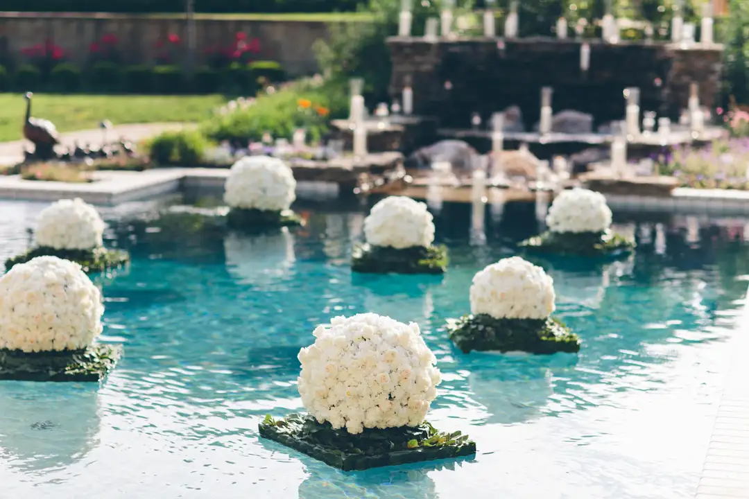 Reception Décor Photos - Manicured Floating Pool Floral Arrangement ...