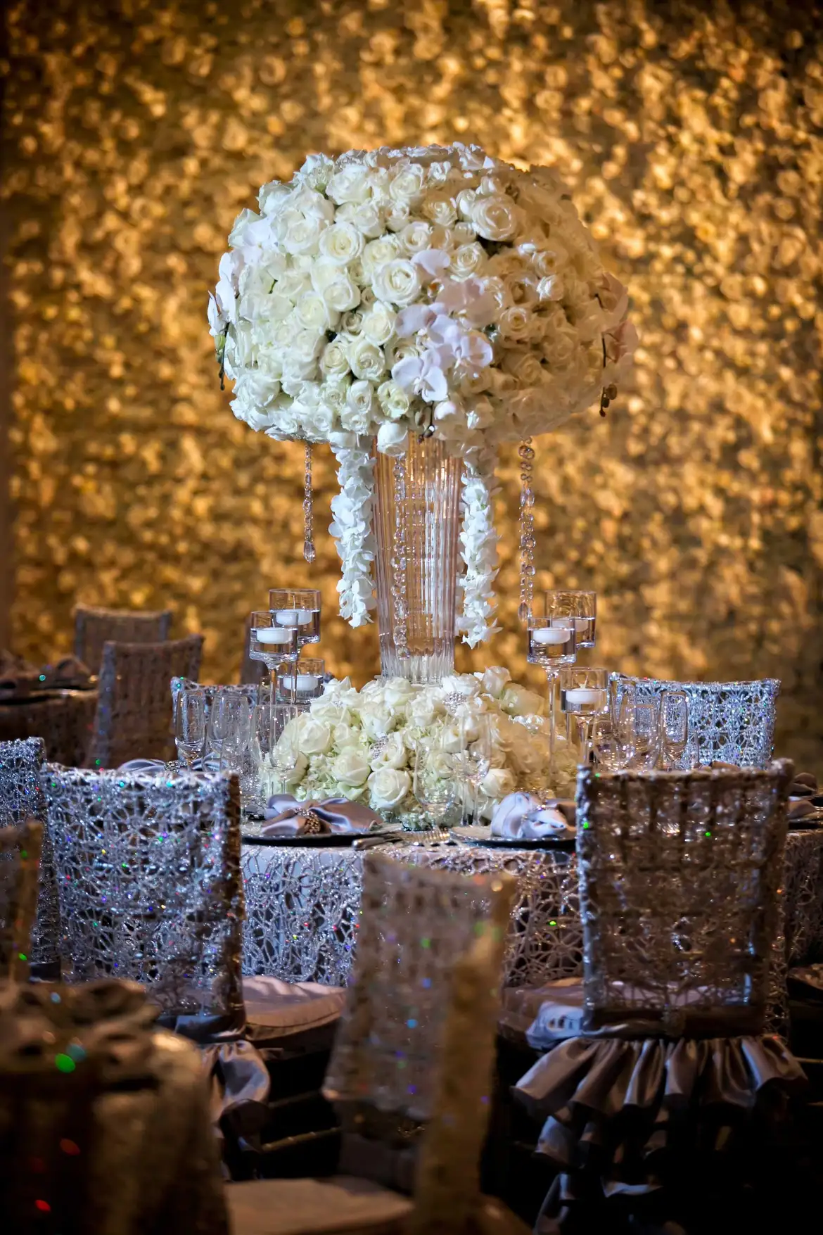 Ivory Wedding Table in Front of Flower Wall