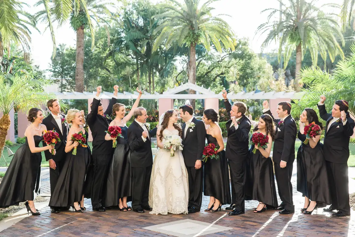 Wedding Party Cheers for Bride and Groom