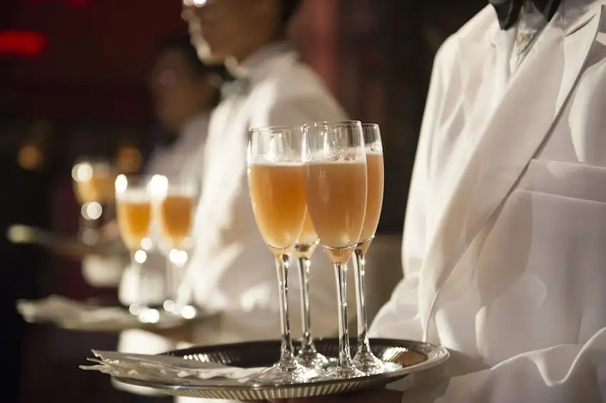 White-Glove Uniform Servers with Drinks