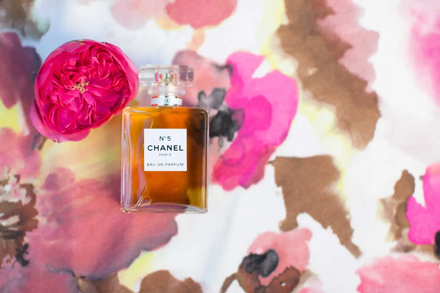 Bottle of Chanel No. 5 On Floral Table Linen