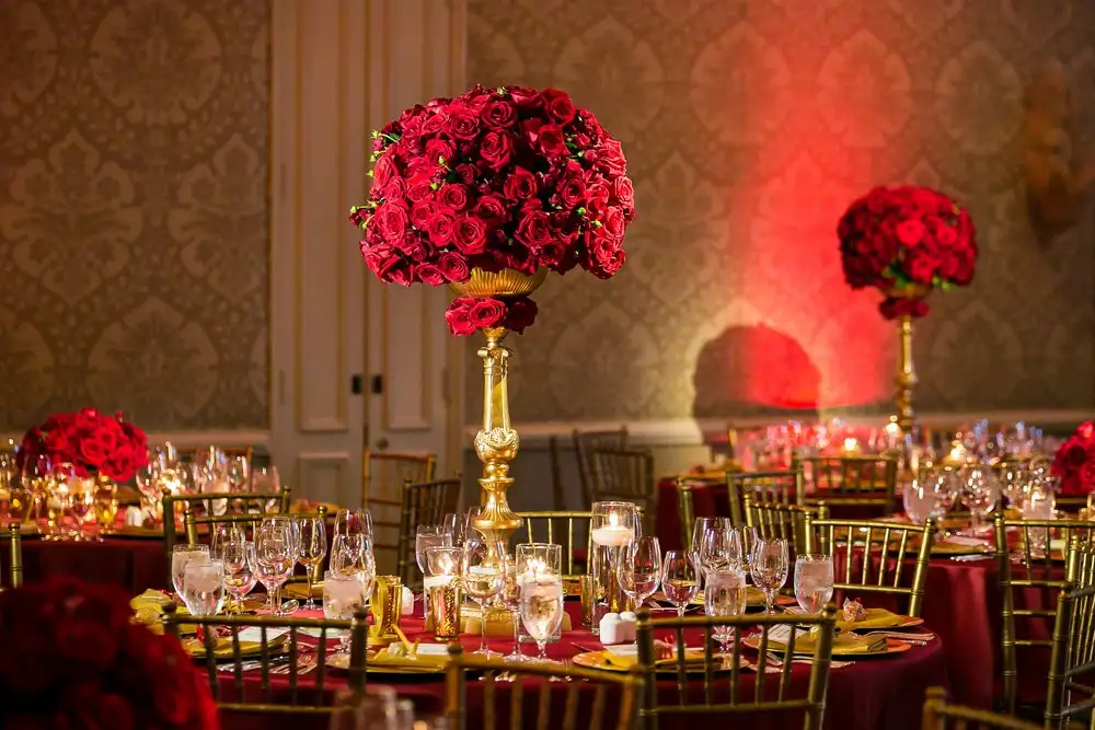 Arrangement of Red Roses on Gold Stands